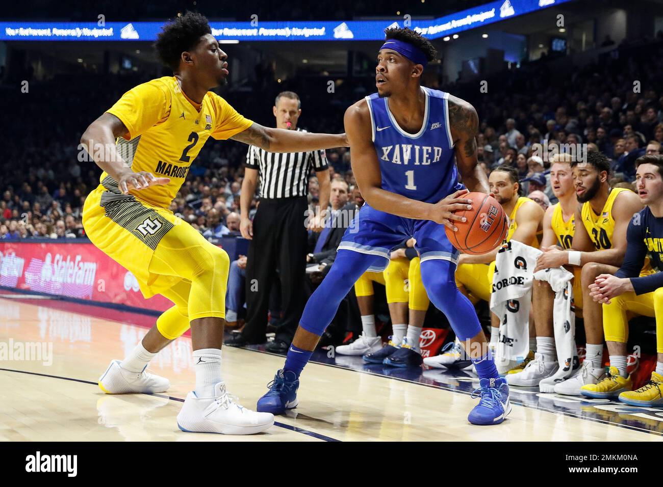 Xavier's Paul Scruggs (1) looks to pass against Marquette's Sacar Anim ...