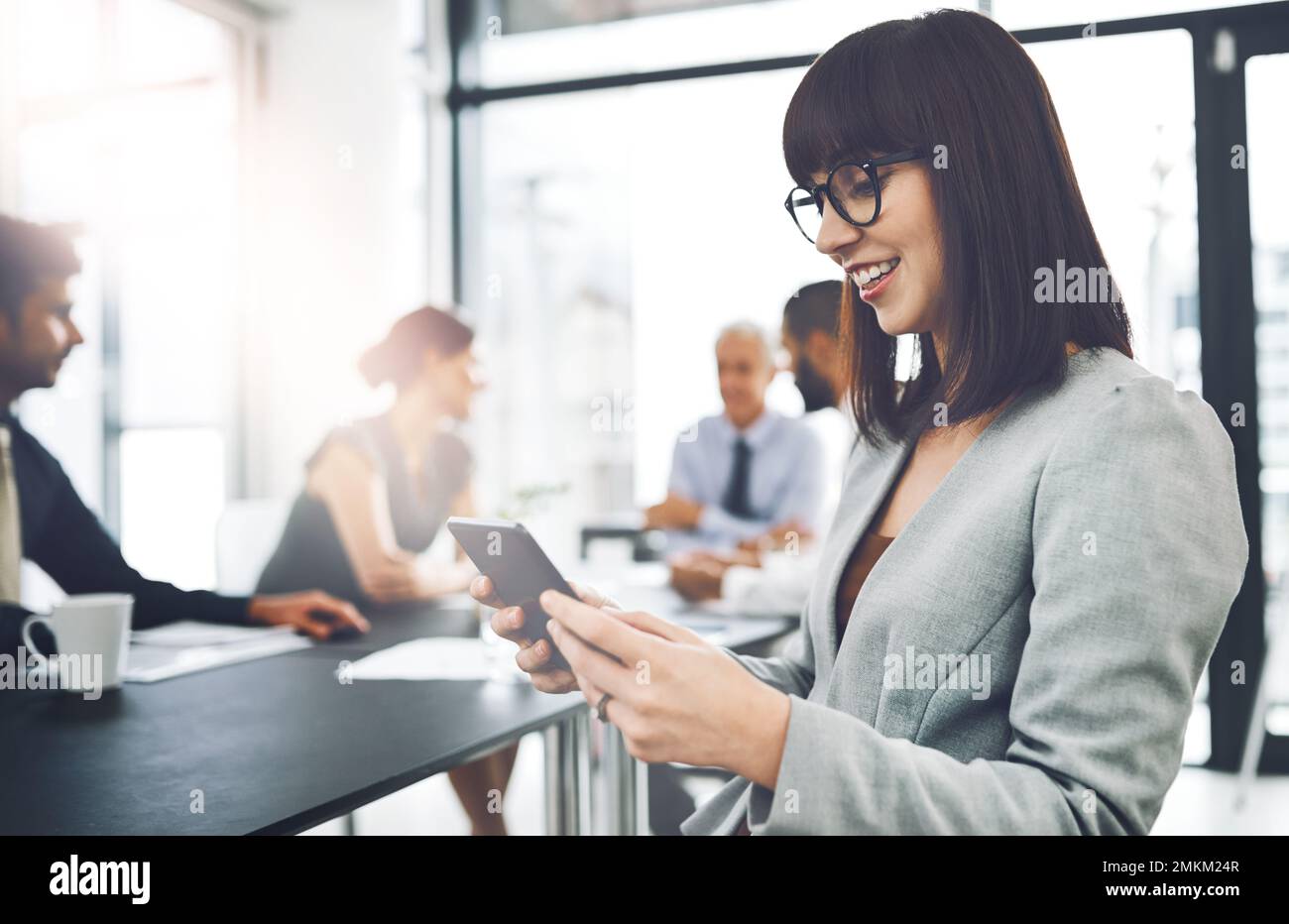 Person texting during meeting hi-res stock photography and images - Alamy