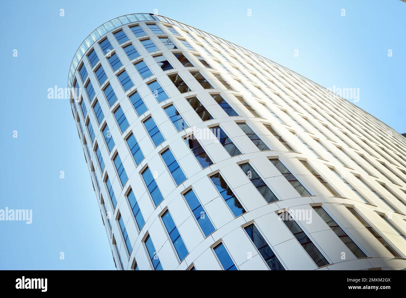 Abstract closeup of the glass-clad facade of a modern building covered ...