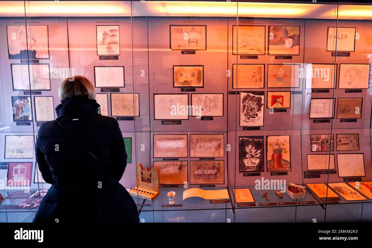 A visitor looks at the collection of drawings at the Jewish Museum in ...