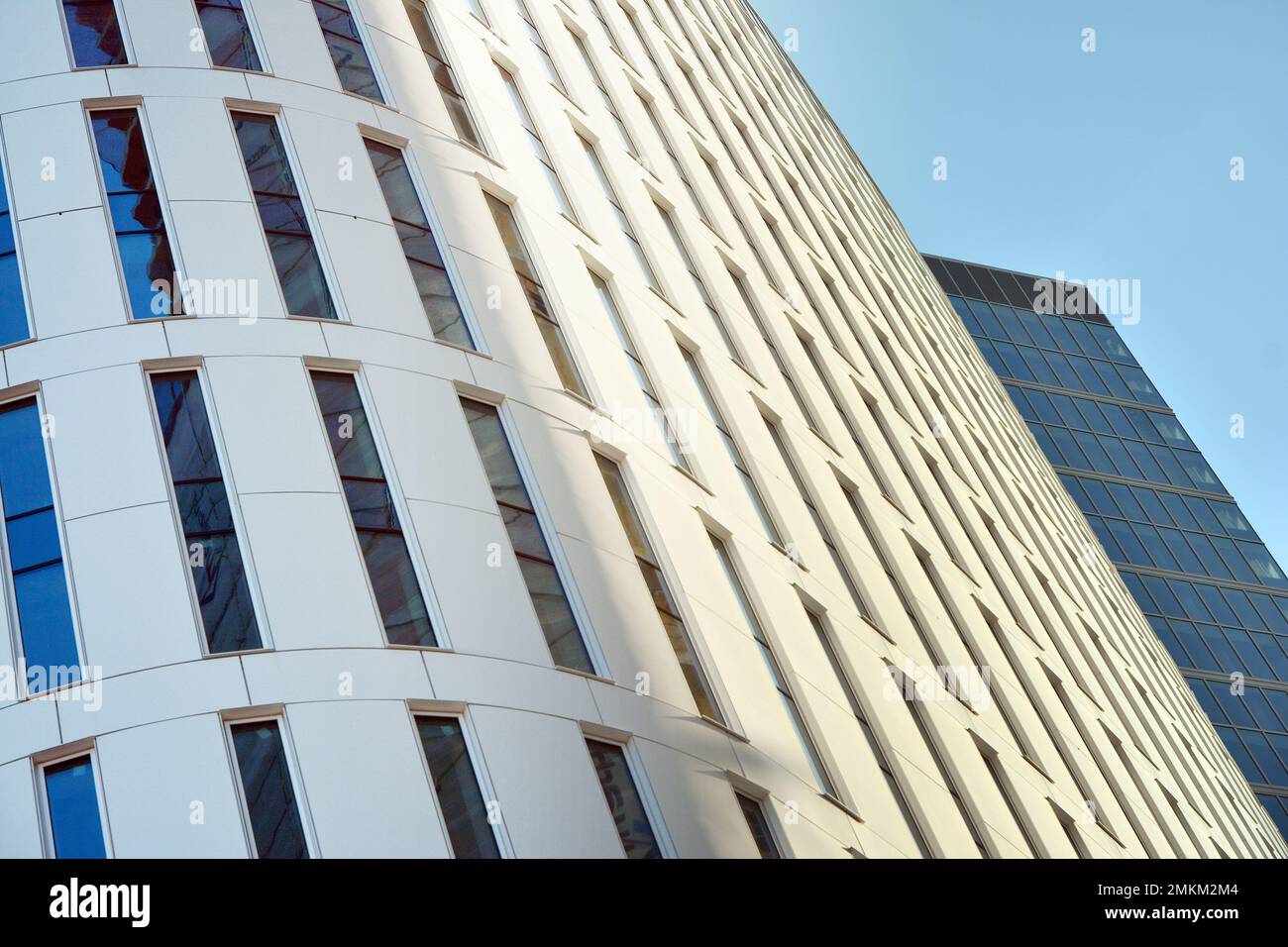Abstract closeup of the glass-clad facade of a modern building covered ...