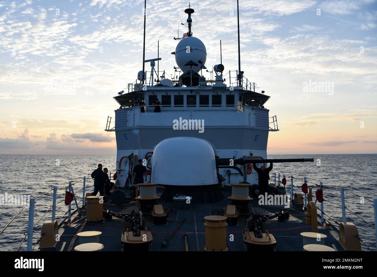 Crew members prepare the deck for a MK-75 gunnery exercise on the USCGC ...