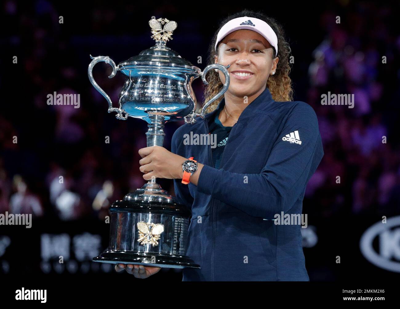 Japan's Naomi Osaka poses with her trophy after defeating Petra Kvitova ...