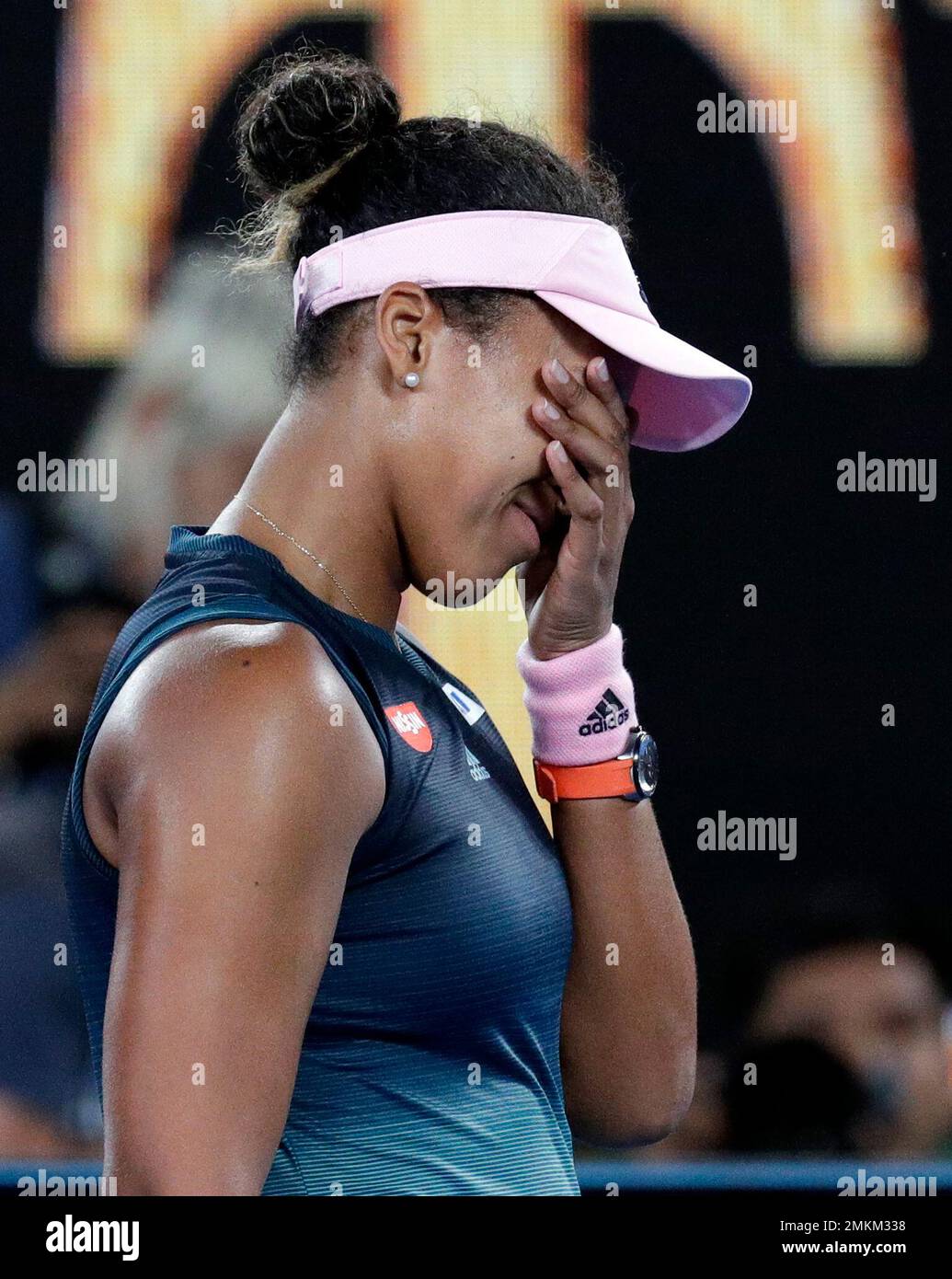 Japan's Naomi Osaka covers her face as she celebrates defeating Petra ...