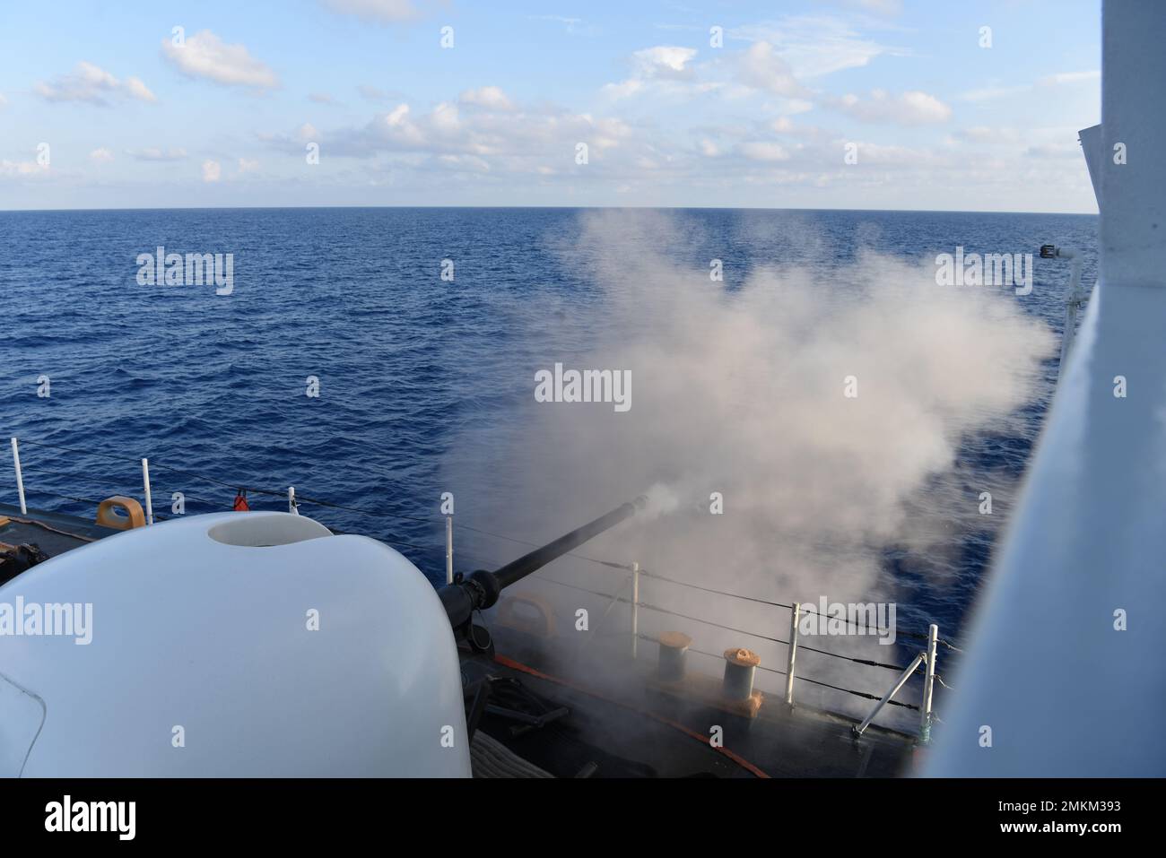 The USCGC Mohawk (WMEC 913) conducts a MK-75 gun exercise while ...