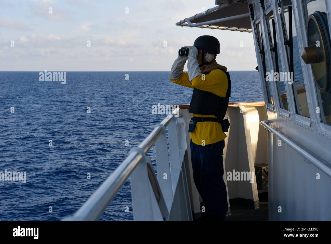 U.S. Coast Guard Seaman Kanon Juneau stands watch during a MK-75 ...