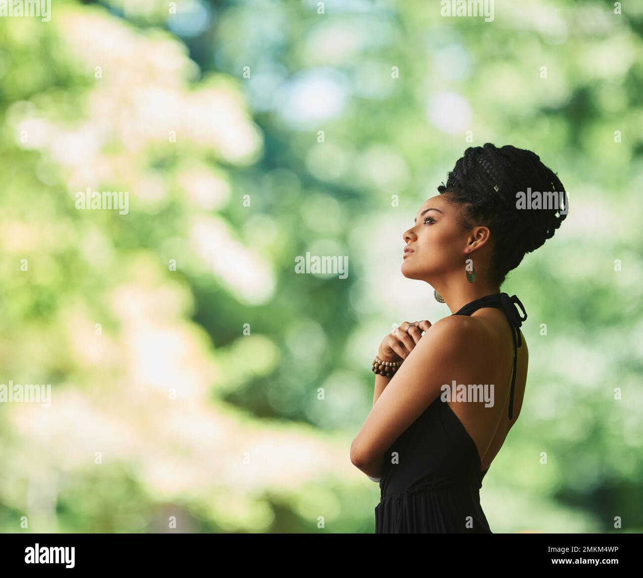 Enticed by the sensuality of nature. an attractive young woman posing ...