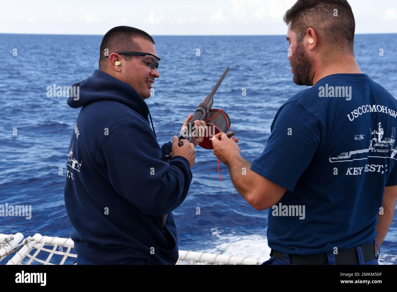 U.S. Coast Guard Petty Officer 1st Class Sean Sanchez and Petty Officer ...