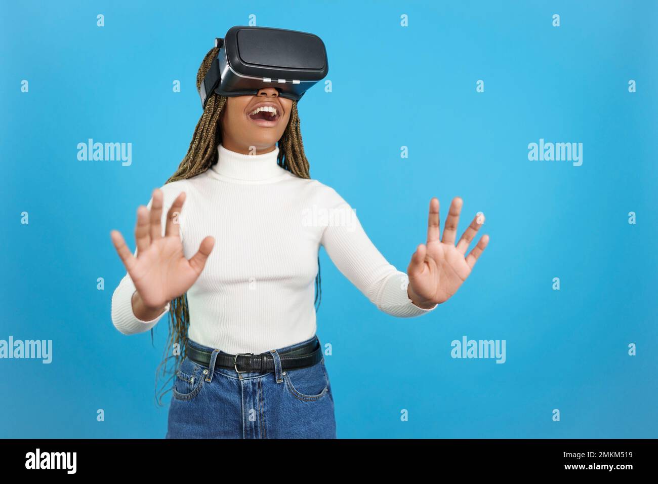 African woman gesturing with hands while using a virtual goggles Stock ...