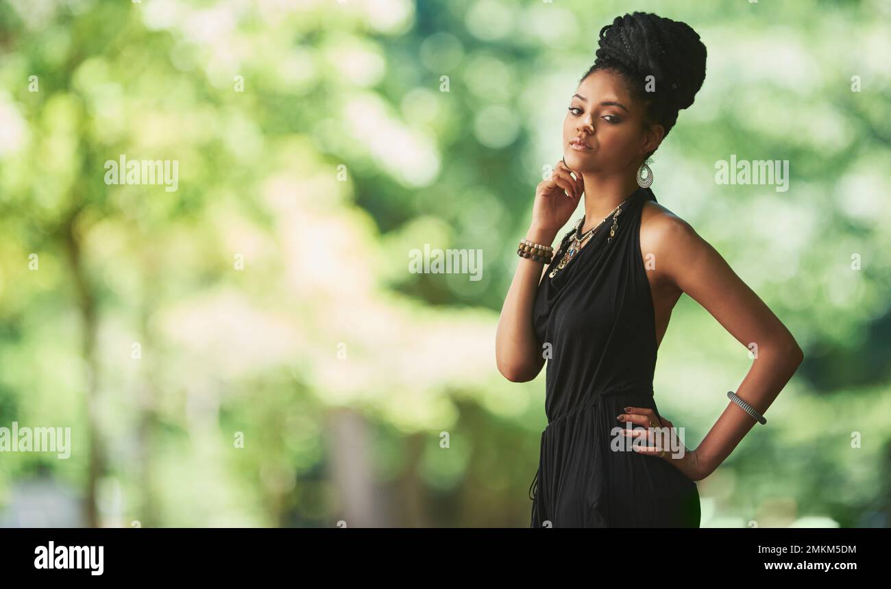 Surrounded by all things good and green. Portrait of an attractive ...