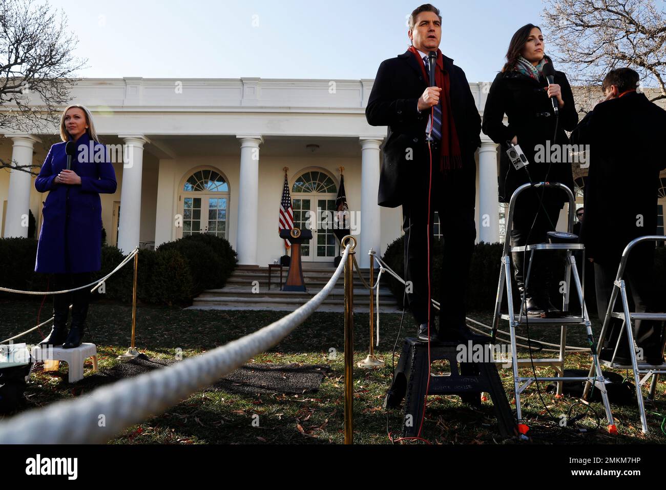 Television correspondents Paula Reed, CBS, left, Jim Acosta, CNN, and ...