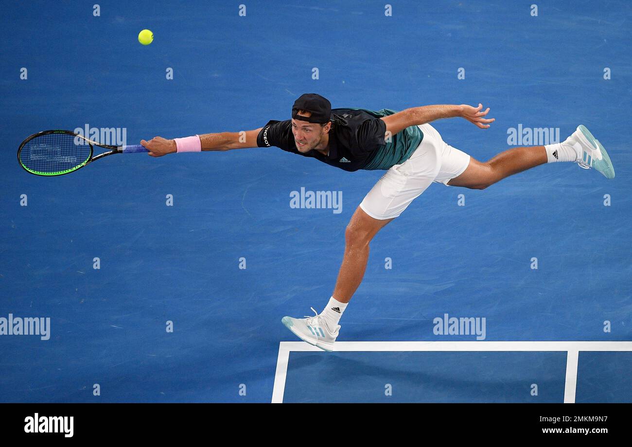 France's Lucas Pouille makes a forehand return to Serbia's Novak ...
