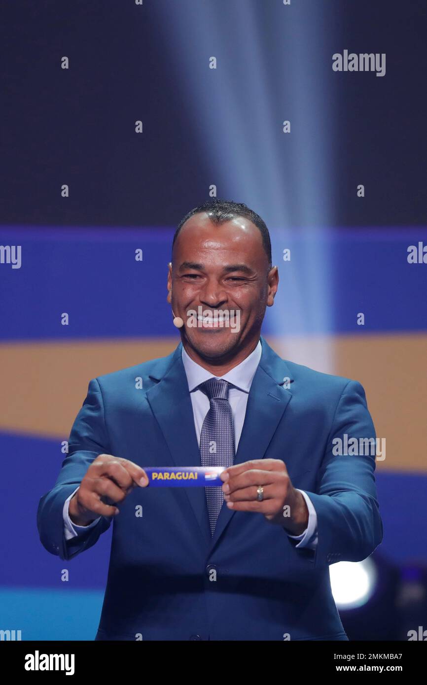 Brazil's former player Cafu holds up the team name of Paraguay during ...