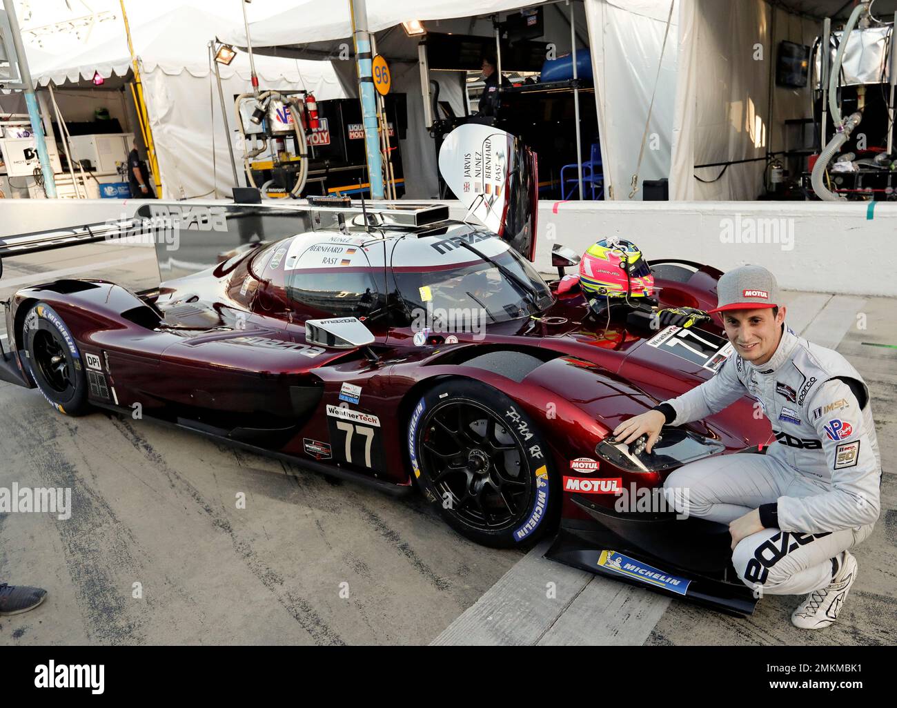 Oliver Jarvis, of Great Britain, kneels by his Maza DPi after ...