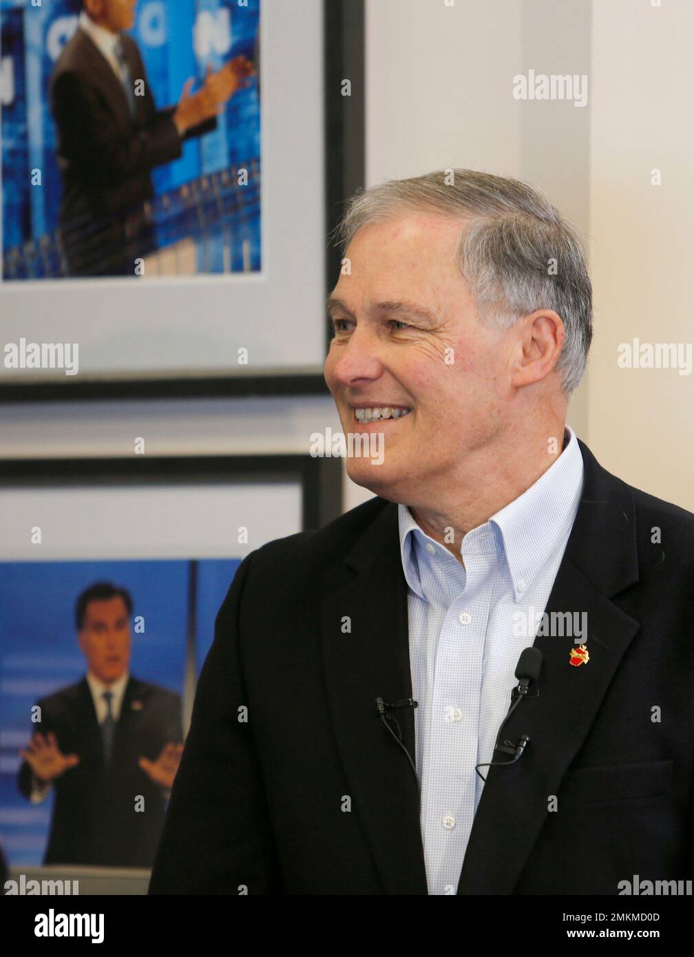 Washington Gov. Jay Inslee smiles as he waits to be introduced while ...