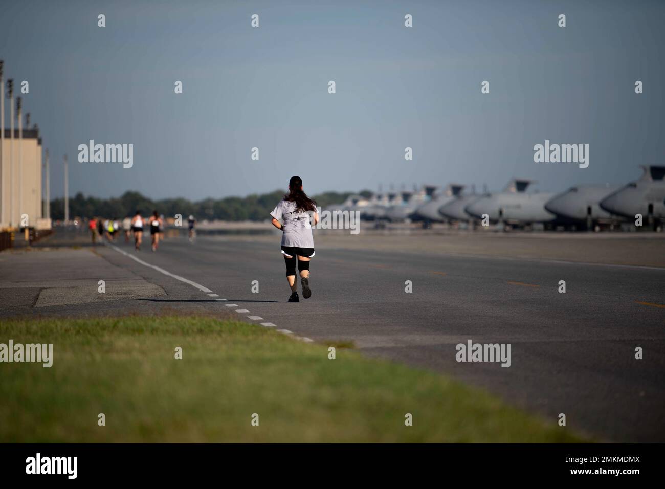 A participant of the Liberty Eagle Half-Marathon races along the ...