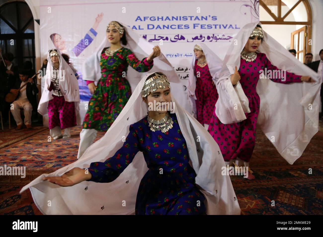 An Afghan dance group performs during a local dance festival, in Kabul ...