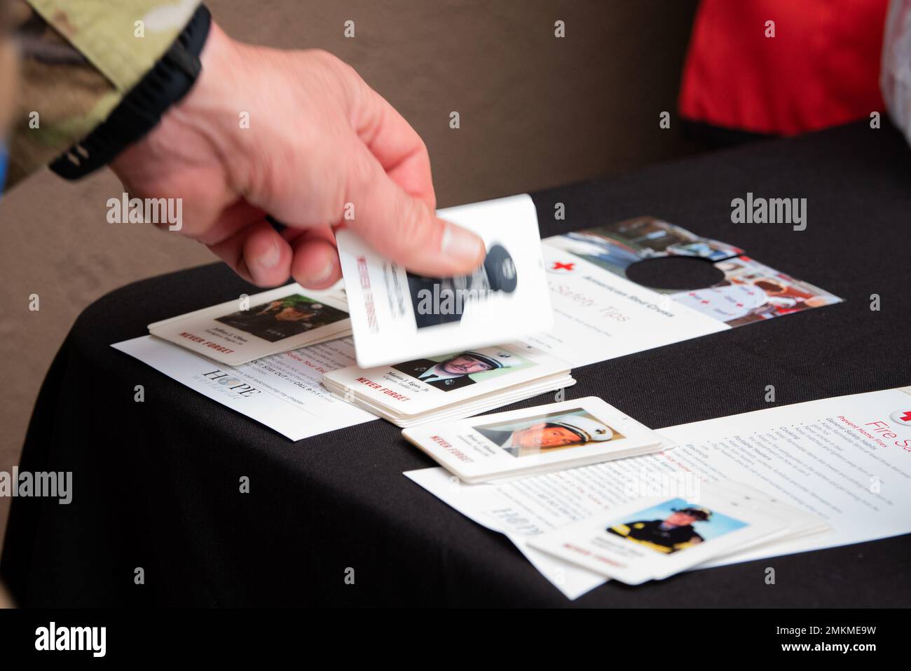 An Airman grabs a first responder card during a 9/11 Remembrance ...