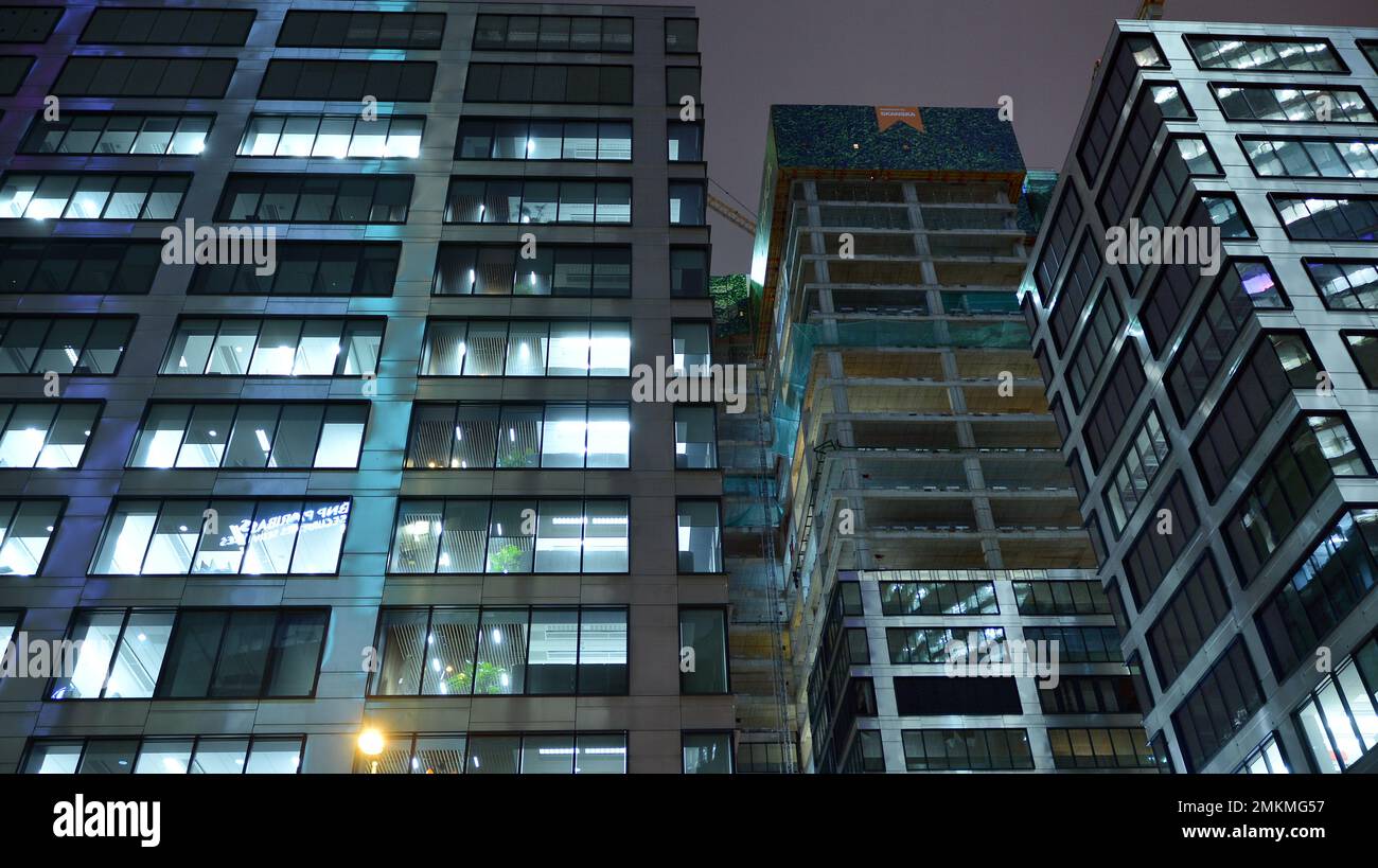 Corporate building at night - business concept. Glass wall office ...