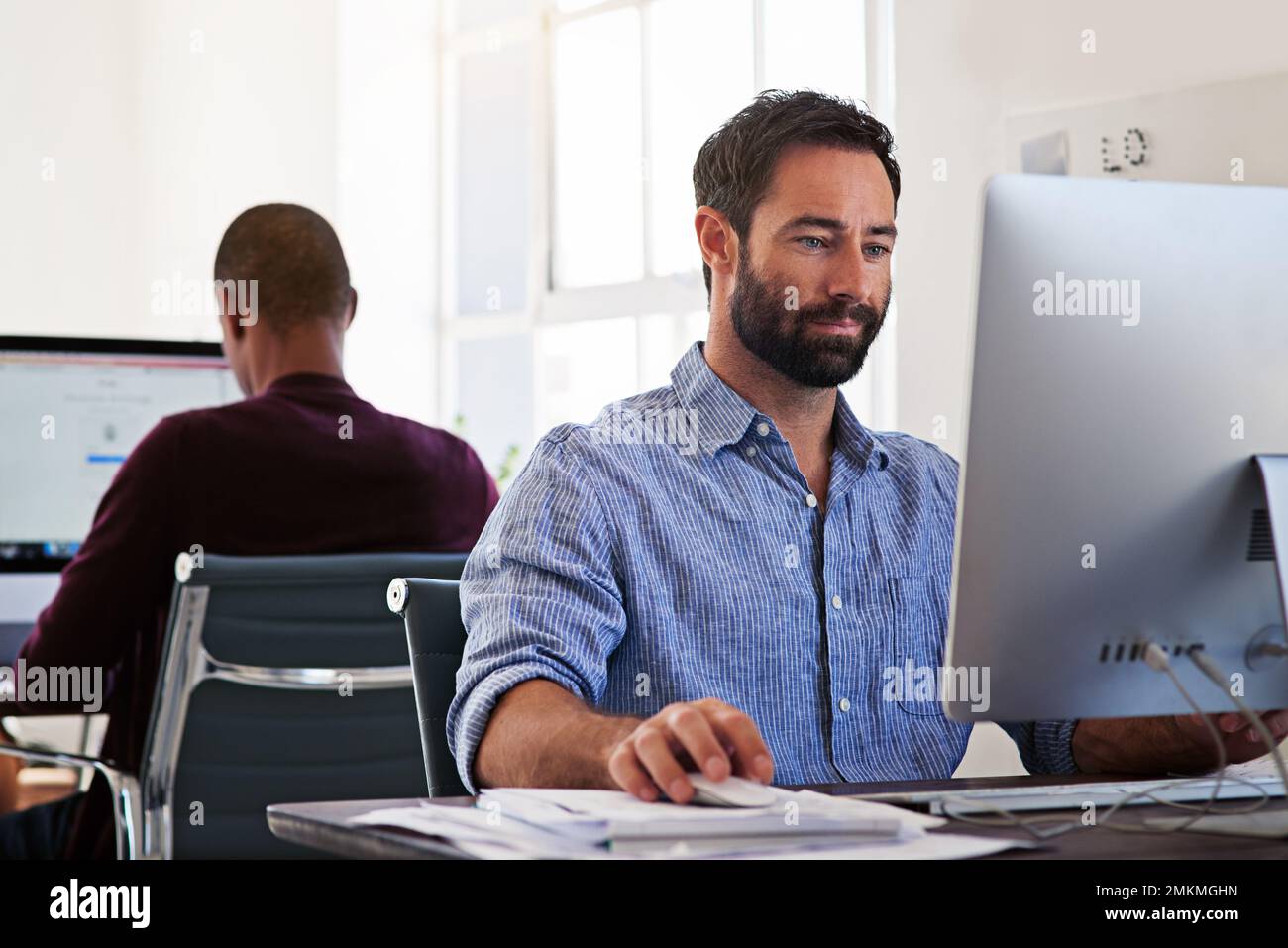 Some of his best designs are created online. colleagues working on ...