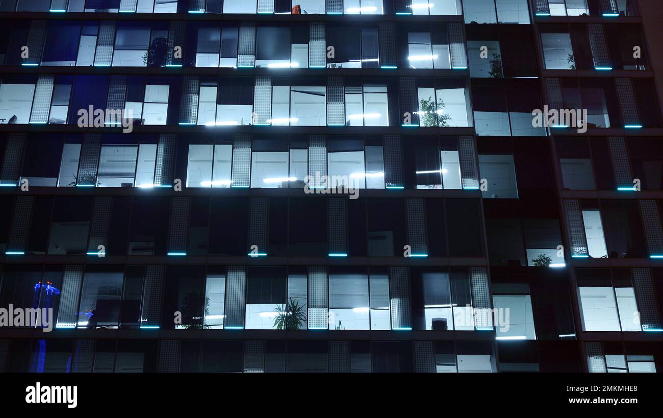Corporate building at night - business concept. Glass wall office ...