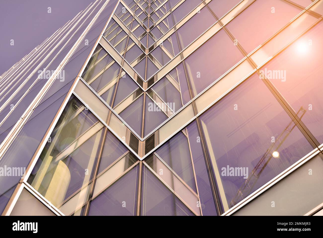 Abstract closeup of the glass-clad facade of a modern building covered ...