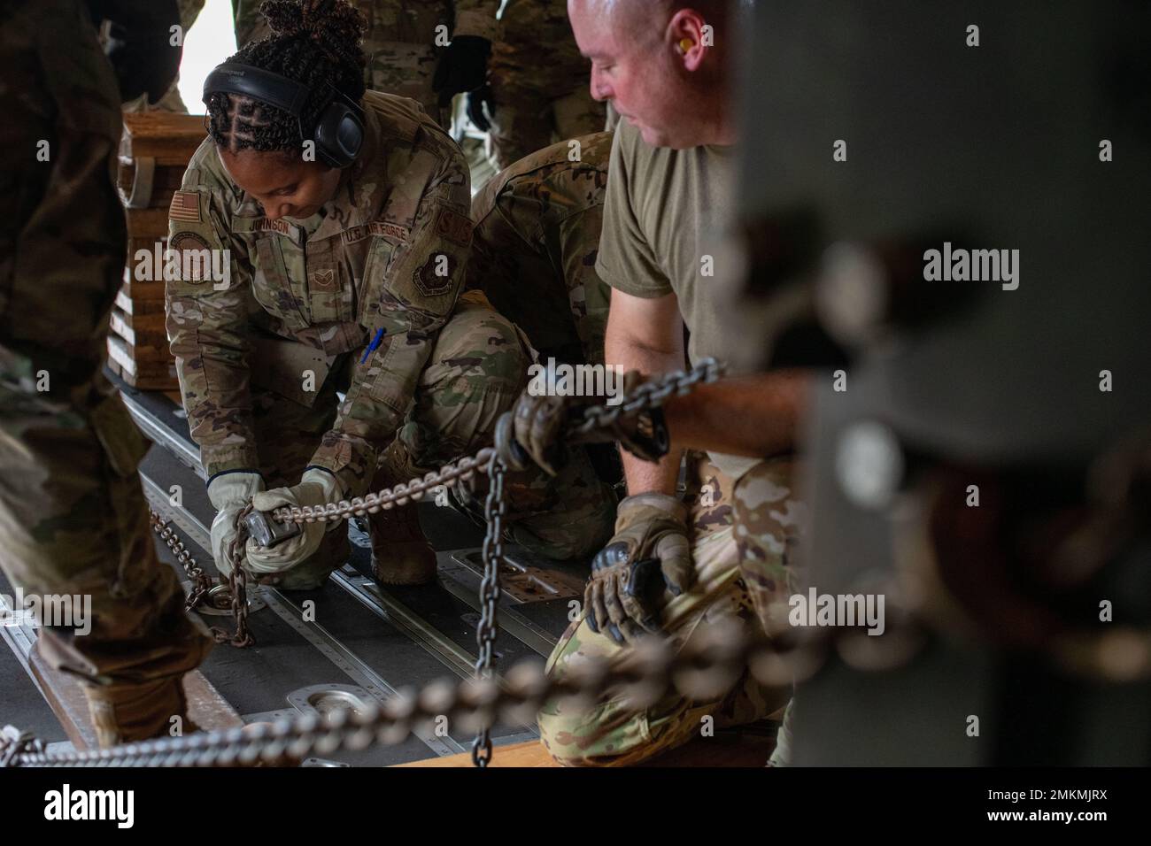 Master Sgt. Joshua Stanton, 815th Airlift Squadron loadmaster, holds a ...