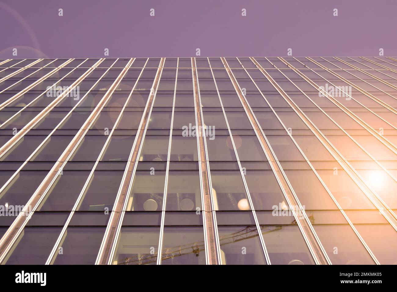 Abstract closeup of the glass-clad facade of a modern building covered ...