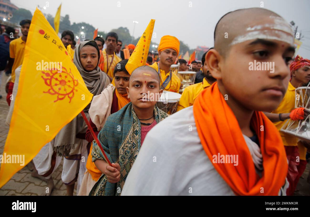 young sadhu, or Hindu holy men, participate in a procession towards the ...