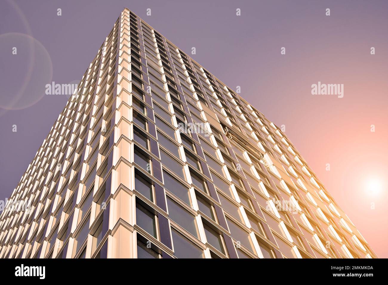 Abstract closeup of the glass-clad facade of a modern building covered ...
