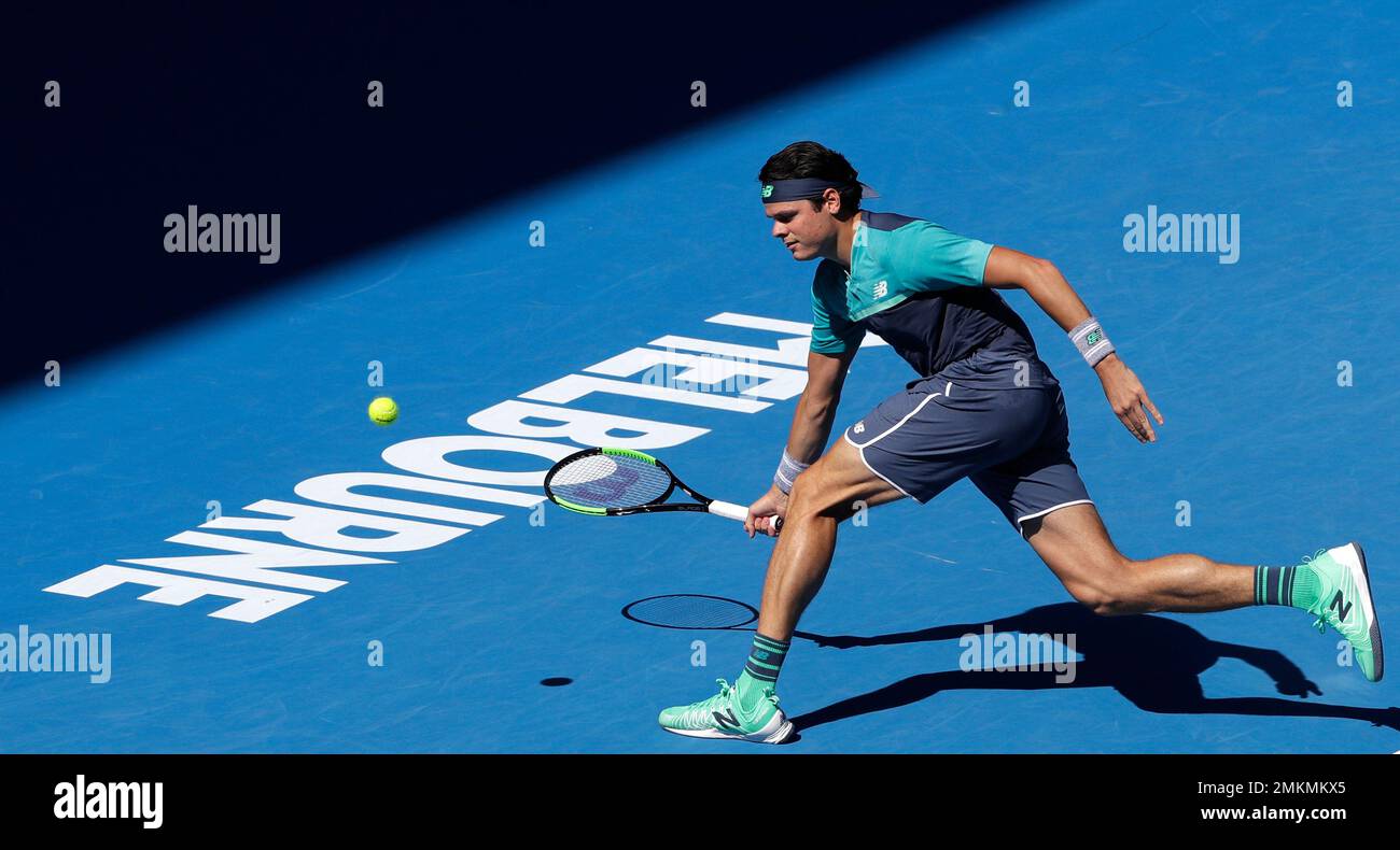 Canada's Milos Raonic looks to make a forehand return to France's Lucas ...