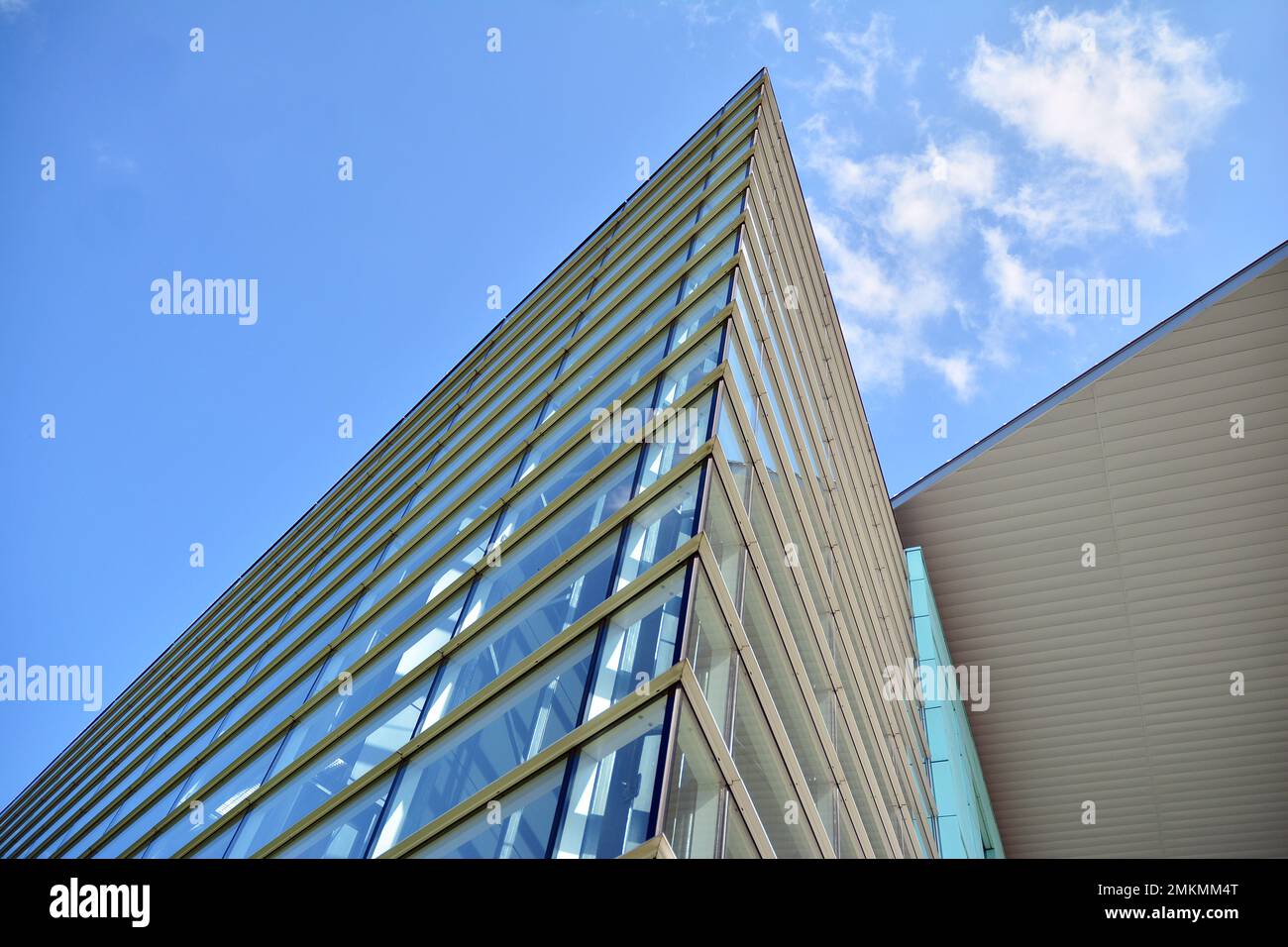 Abstract closeup of the glass-clad facade of a modern building covered ...