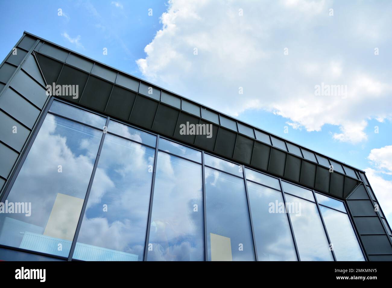 Abstract closeup of the glass-clad facade of a modern building covered ...