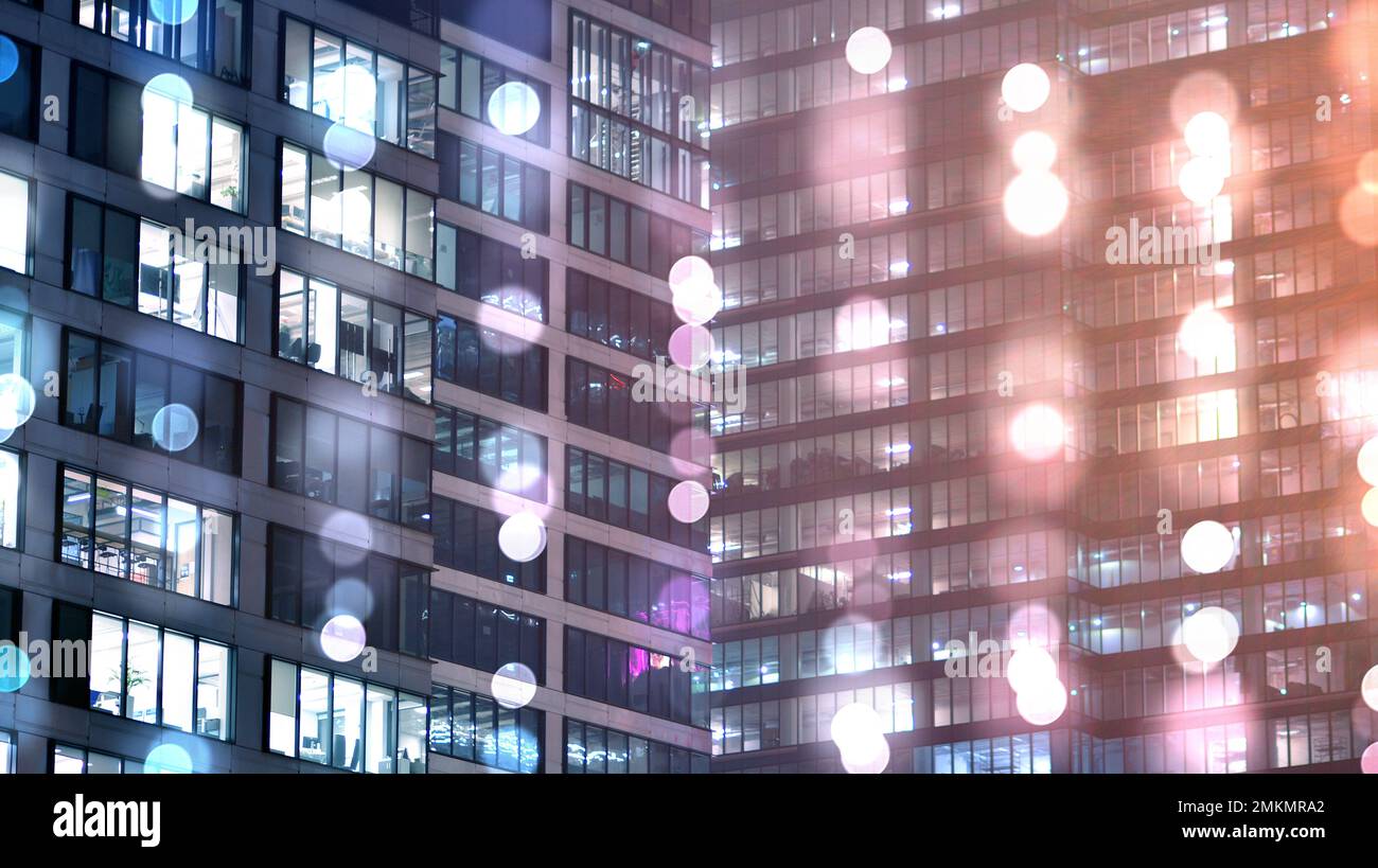 Pattern of office buildings windows illuminated at night. Glass ...