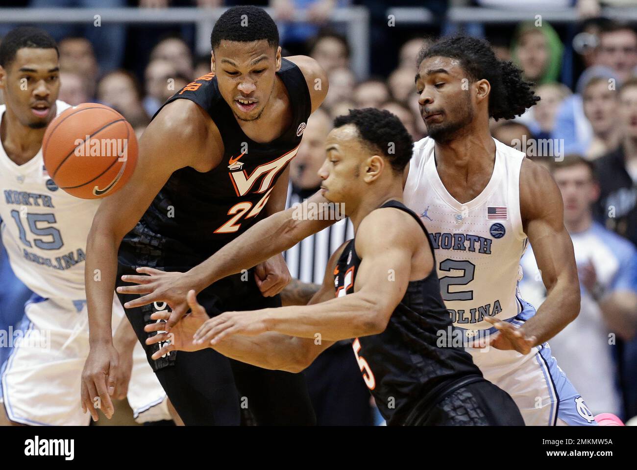 North Carolina's Coby White (2) chases the ball with Virginia Tech's ...