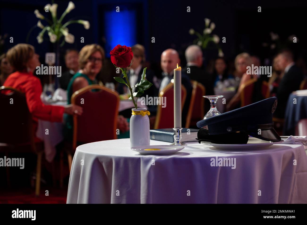 Airmen recognize the POW/MIA table and perform a silent toast during ...