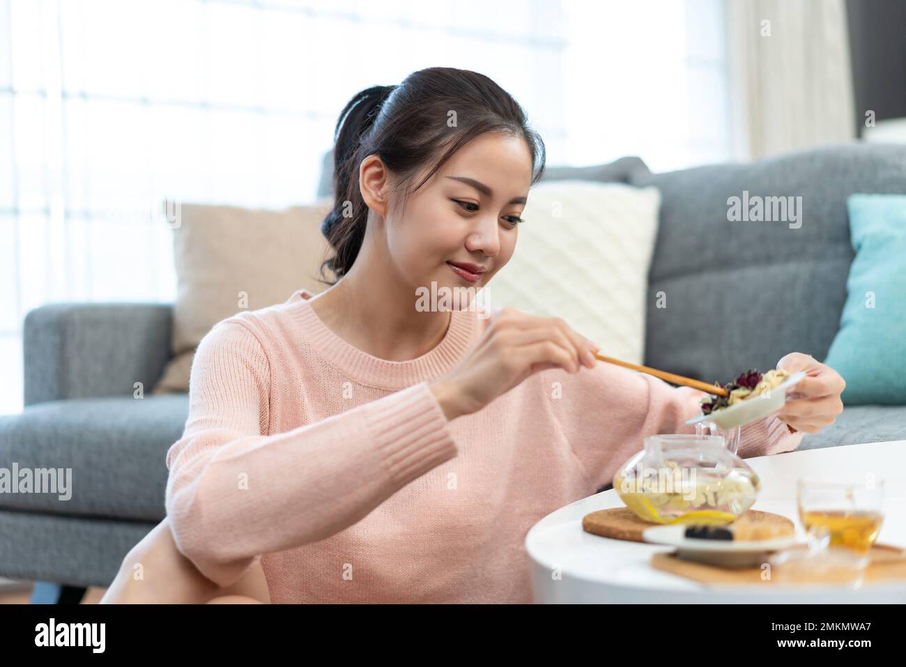 The young lady have afternoon tea at home Stock Photo - Alamy