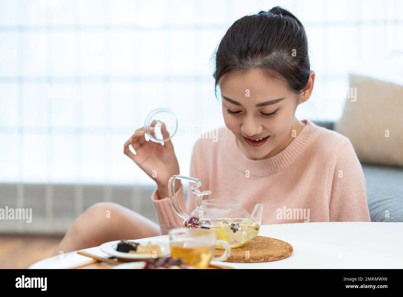 The young lady have afternoon tea at home Stock Photo - Alamy