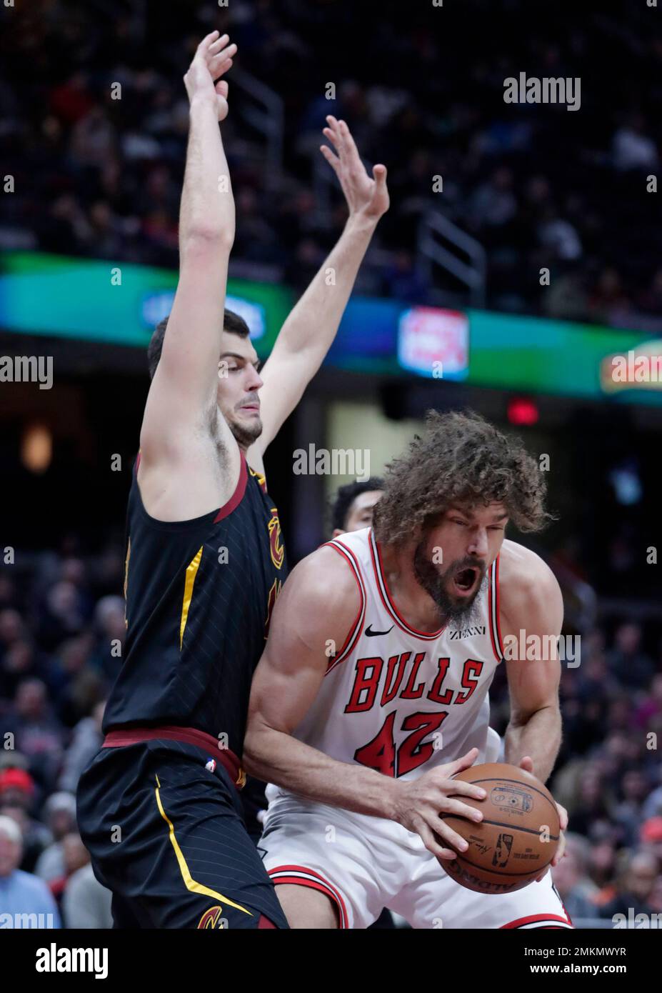 Chicago Bulls' Robin Lopez, right, drives past Cleveland Cavaliers ...