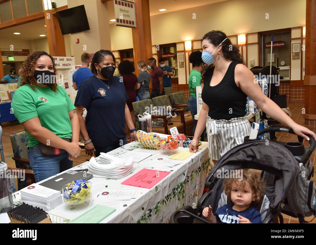 Mom visits patient administration booth during Maternity Fair Womack ...