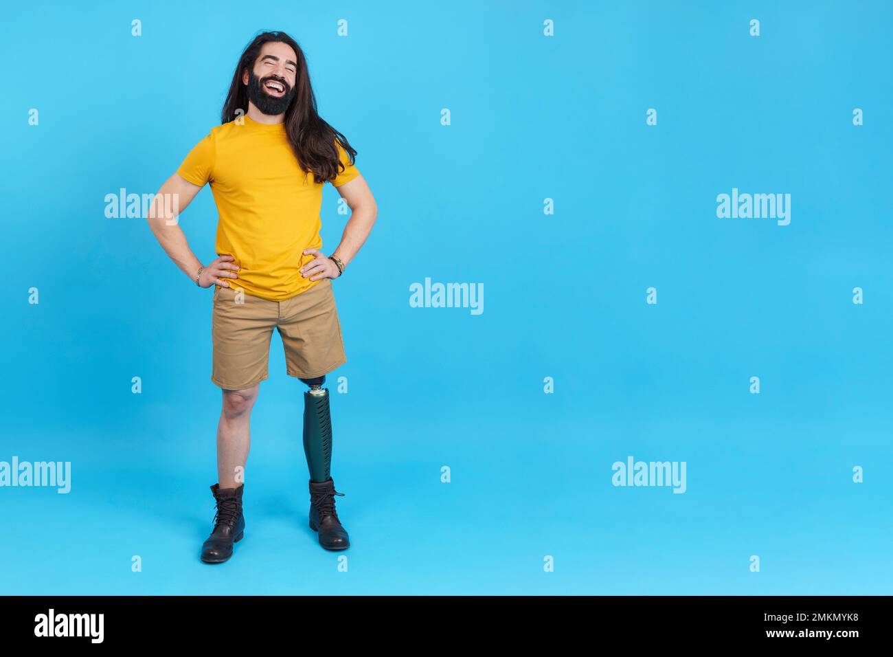 Happy man with prosthesis leg smiling while posing Stock Photo - Alamy