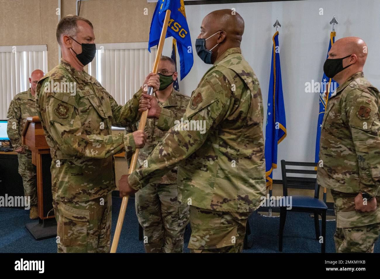 U.S. Air Force Lt. Col. Corey Gause, center, hands the 167th Mission ...