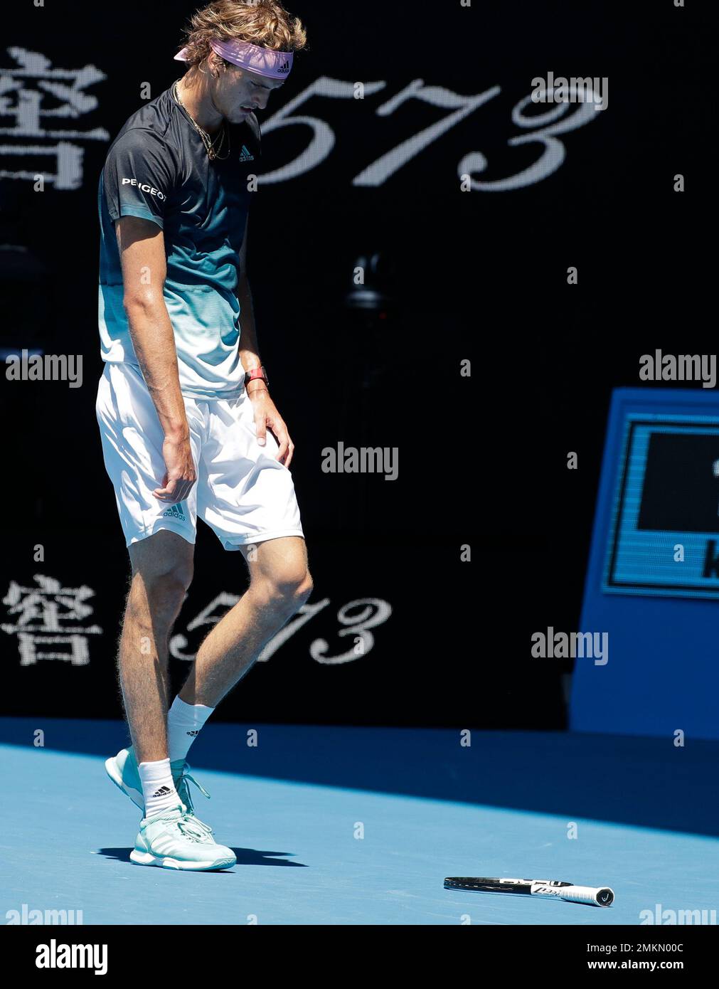 Germany's Alexander Zverev walks to retrieve his racket during his ...