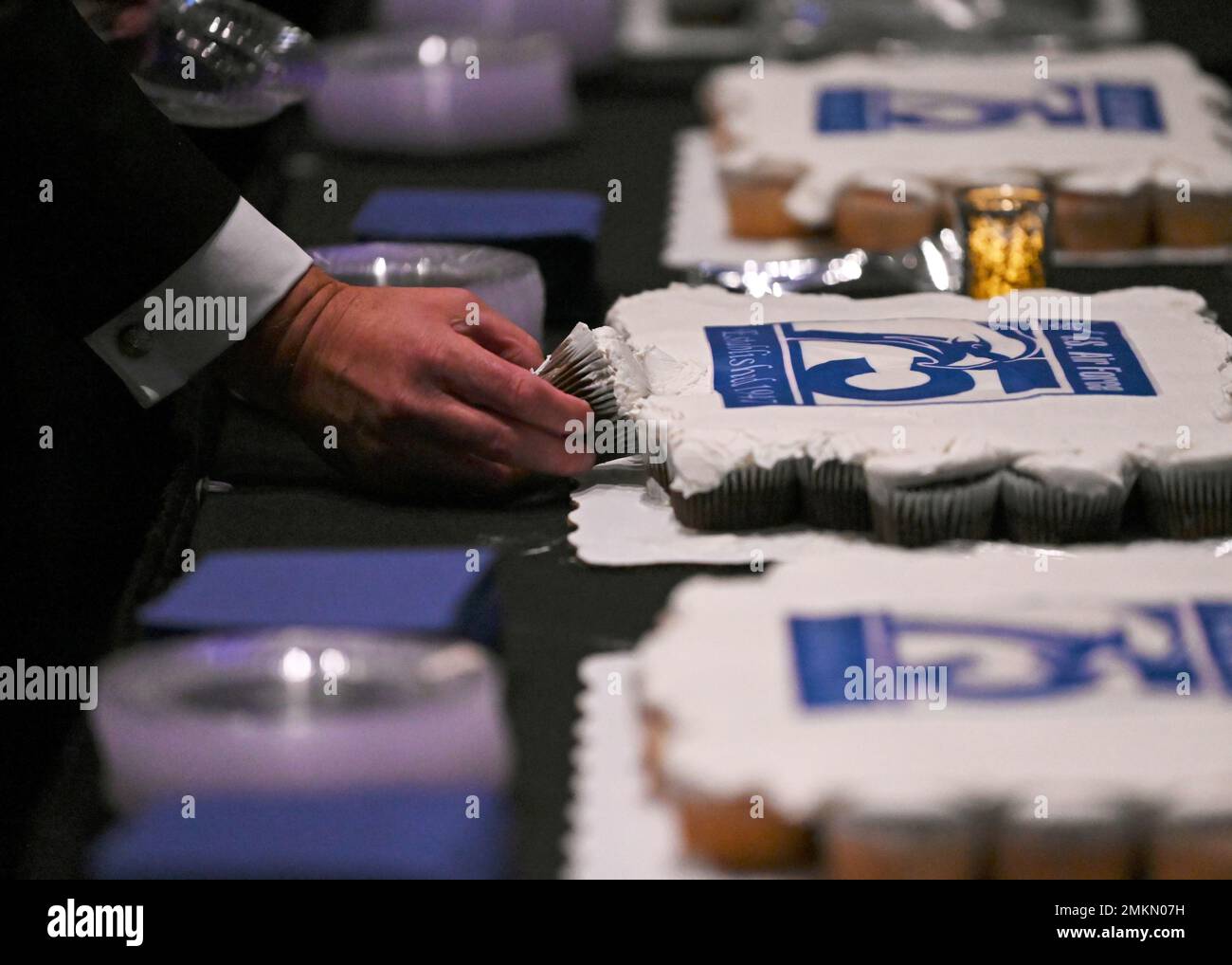 Attendees enjoy the Air Force’s 75th Anniversary cake during the Team ...
