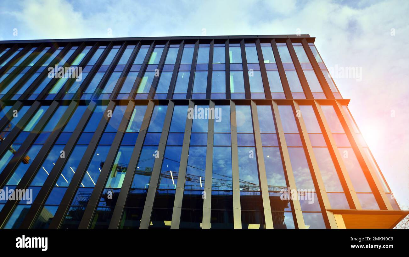 Abstract closeup of the glass-clad facade of a modern building covered ...