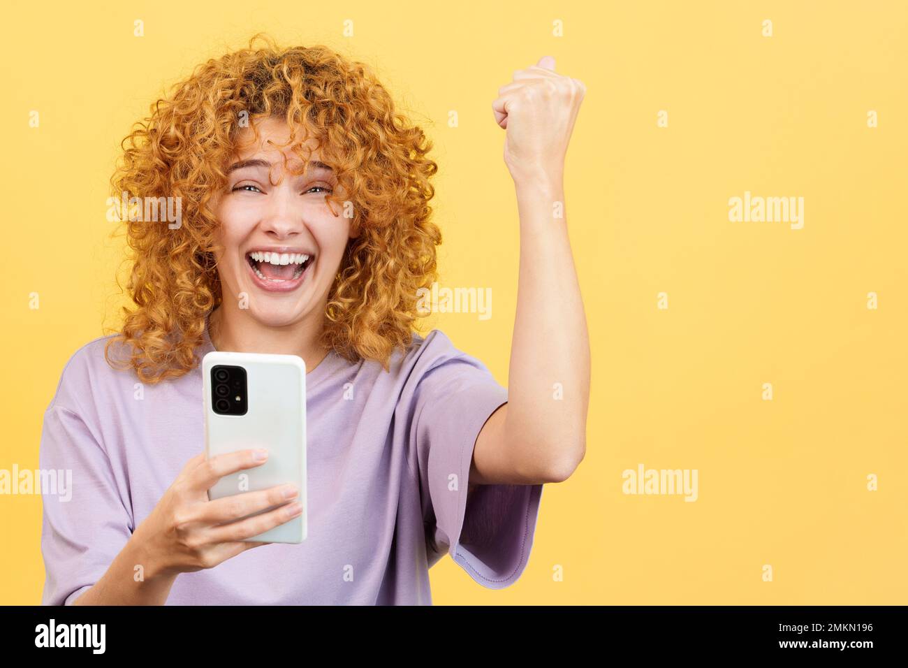 Excited woman celebrating using hi-res stock photography and images - Alamy