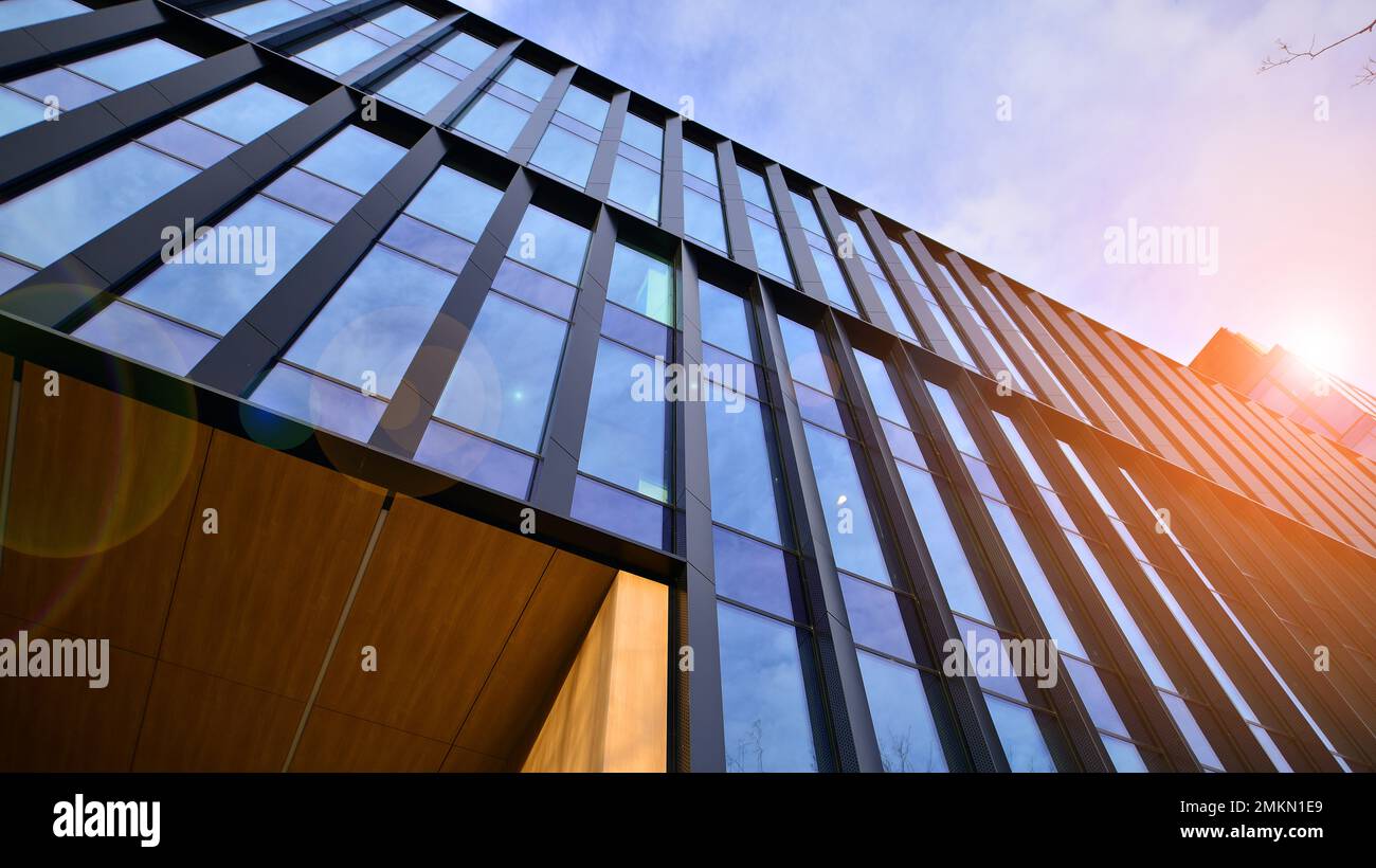 Abstract closeup of the glass-clad facade of a modern building covered ...