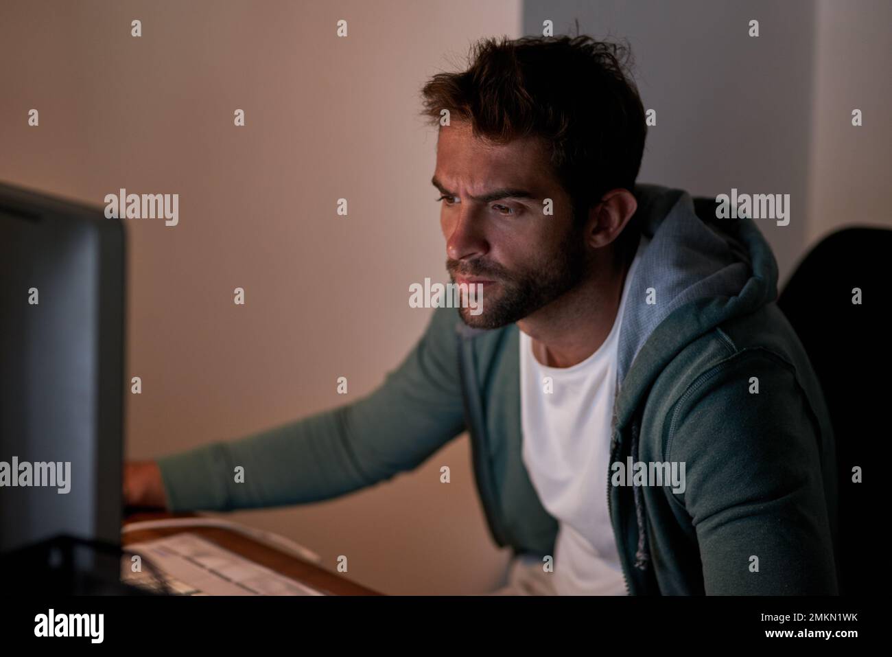 Pulling an all-nighter. a young designer working late in the office ... Pulling an all-nighter. a young designer working late in the office ...