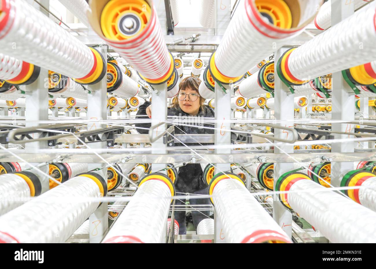 HUZHOU, CHINA - JANUARY 27, 2023 - A worker makes bulletproof composite ...