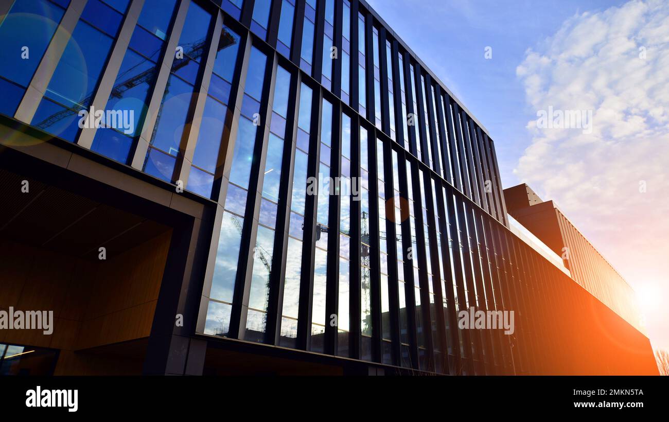 Abstract closeup of the glass-clad facade of a modern building covered ...
